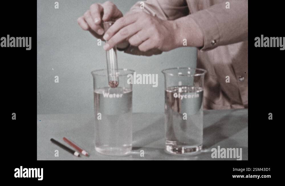 1960s: Person places weighted test tube in water. Person uses grease ...