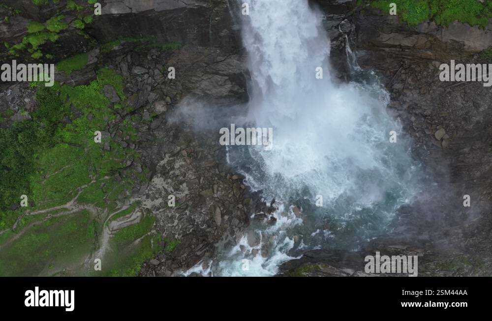 Water reaching the bottom of a Krimml waterfall. Aerial and slow motion ...