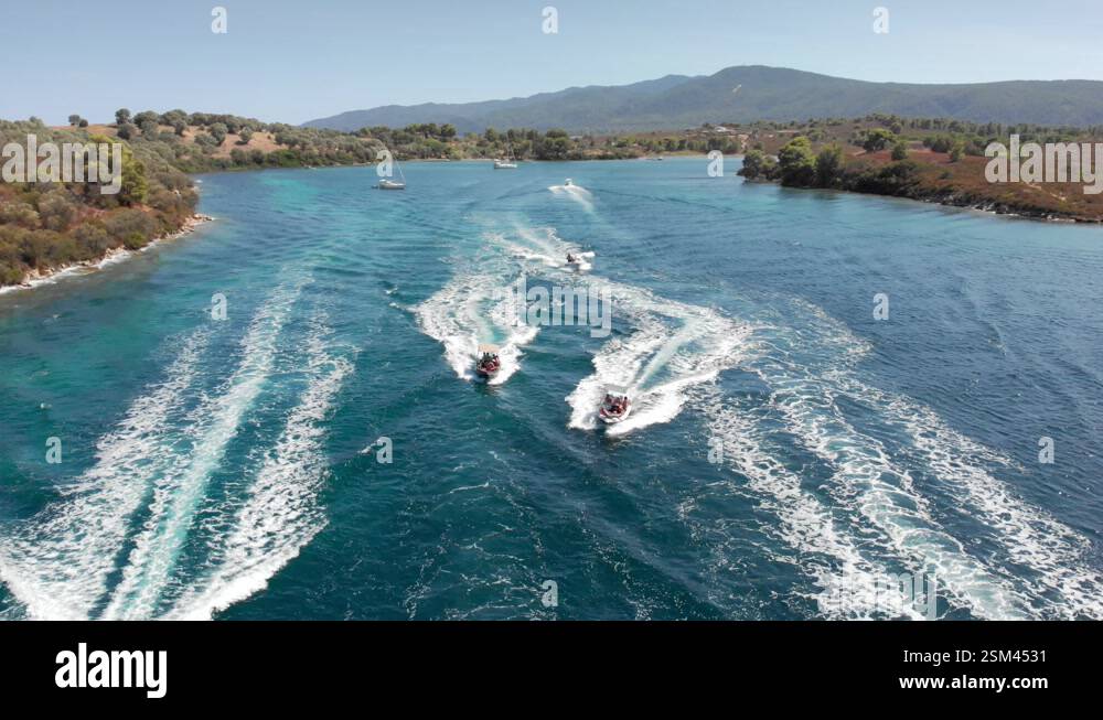 Drone Tracking Leisure Boats Cruising Full Speed blue water Greece ...