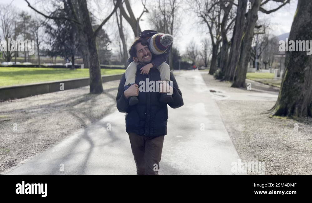 Sweet Bonding Moments, Adorable Boy Cuddles Up to Father on Shoulder ...