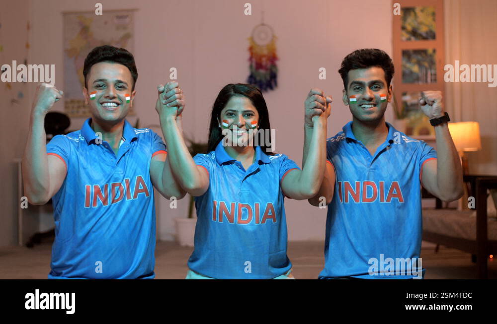 Young Indian cricket fans holding hands and celebrating their cricket ...