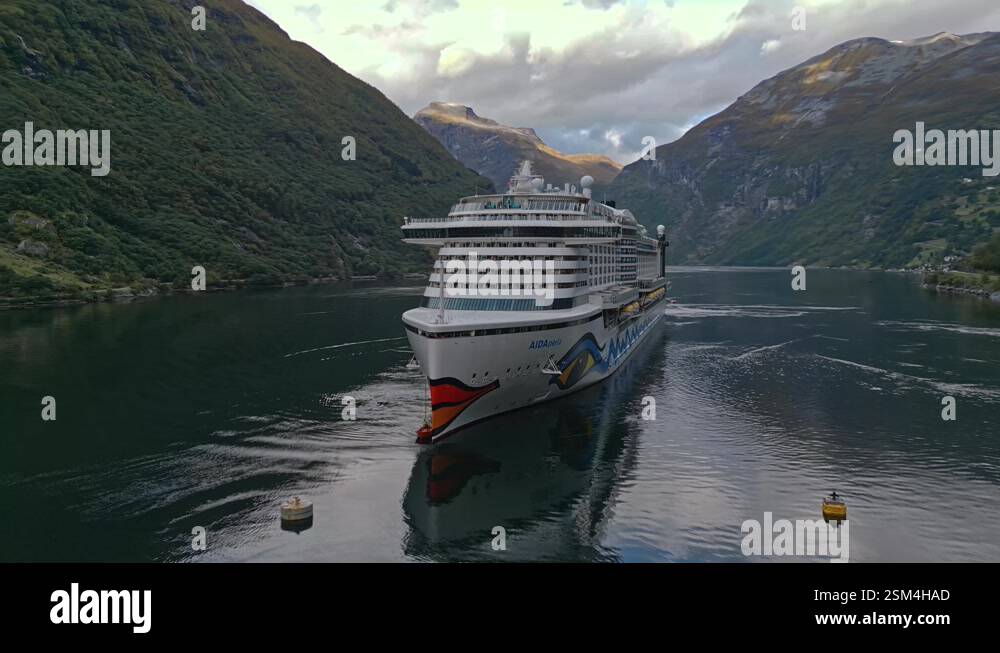 Aerial of a cruise ship from the AIDA line moored of the village of ...