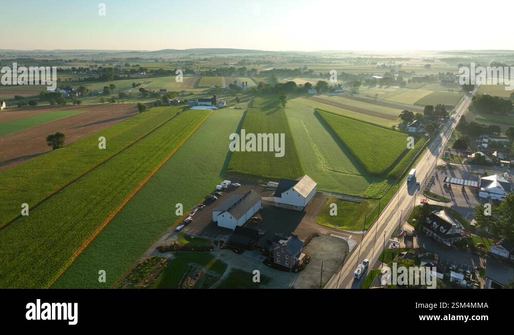 Rural farmland and town in USA. Aerial truck shot during morning ...