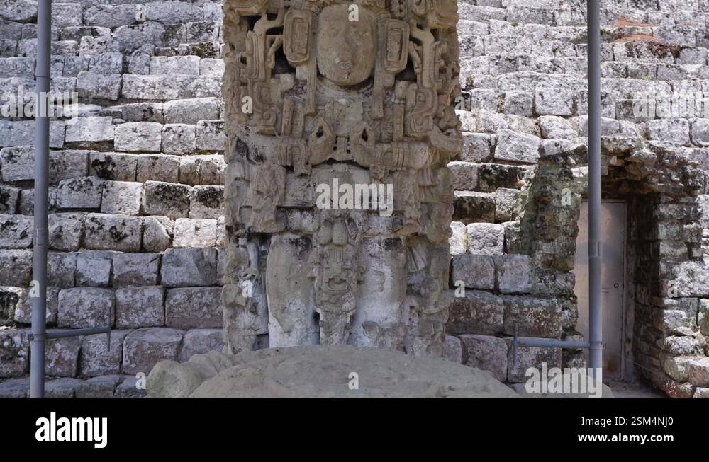 Tilt up Stela N stone carving portrait of early Mayan ruler at Copan ...