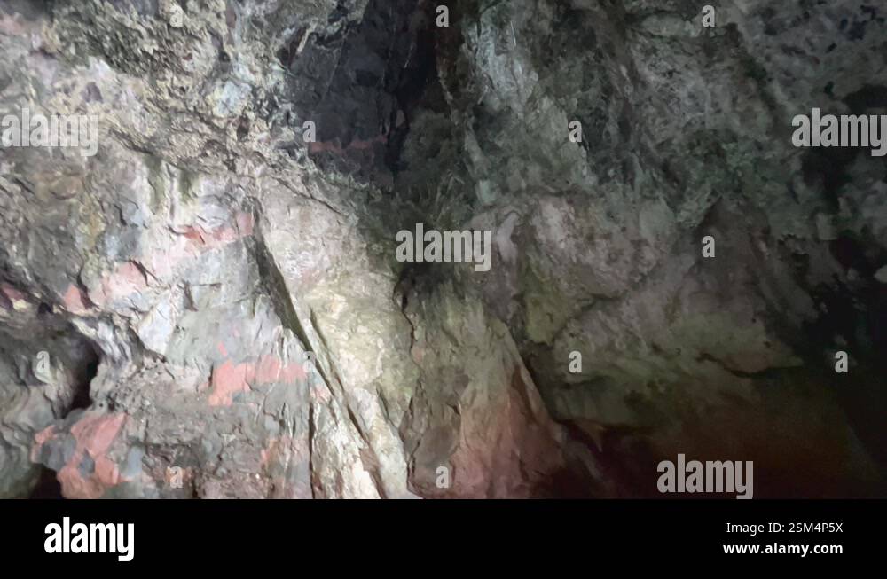 Water dripping from ceiling cave in sea water at Calanques de Piana in ...