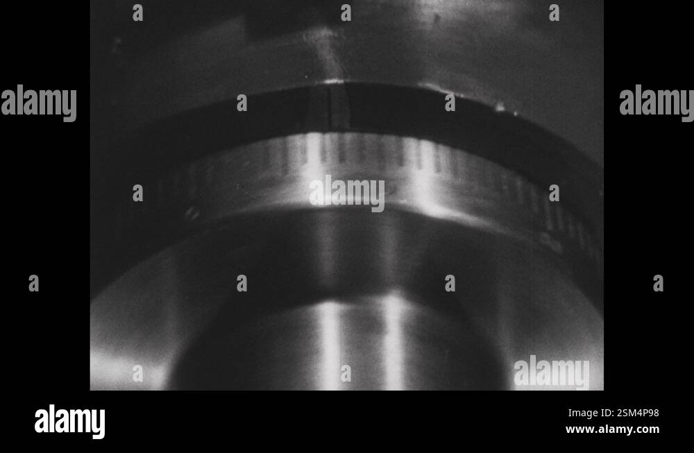 1940s: numbered dial turns clockwise, man rotates lever on industrial ...