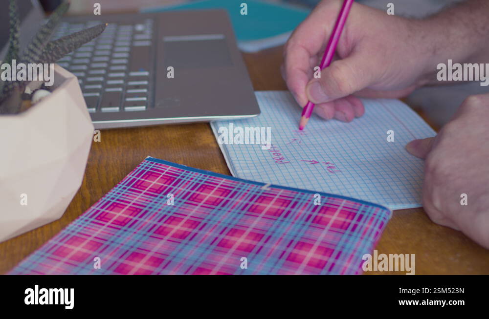 Hands of a business person working with a paper document at a desk ...