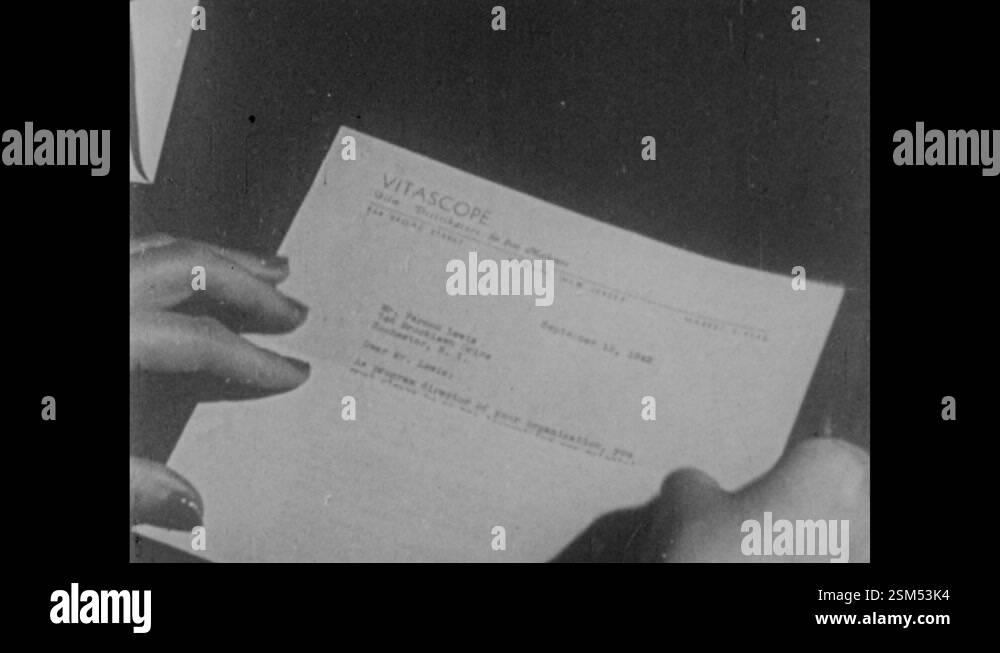 1940s: Letter being folded with the address facing out, placed in an ...