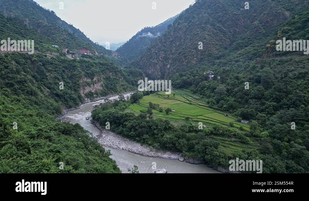 A drone view of an epic highland landscape, valley, and the Bhagirathi ...