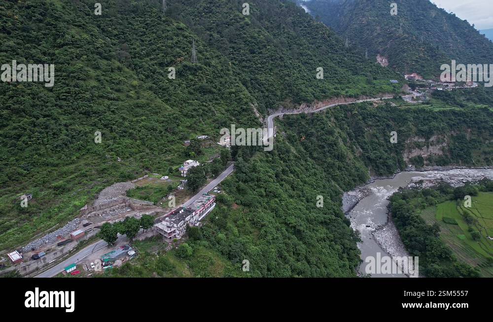 A drone view of an epic highland landscape, valley, and the Bhagirathi ...