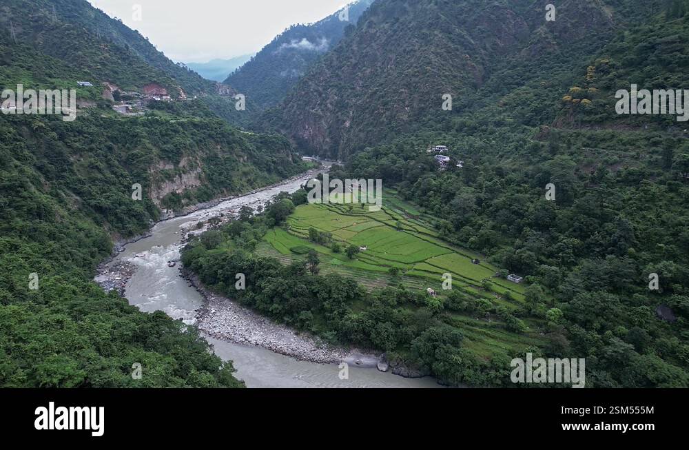 A drone view of an epic highland landscape, valley, and the Bhagirathi ...