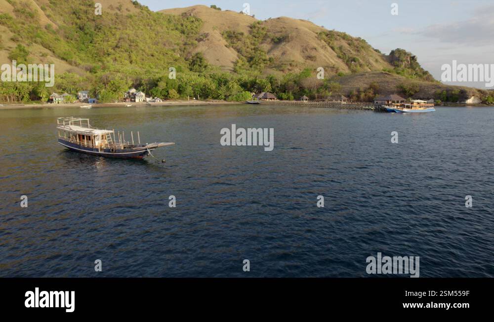 Komodo aerial of the beach and reef on a hot sunny day at sunset Stock ...