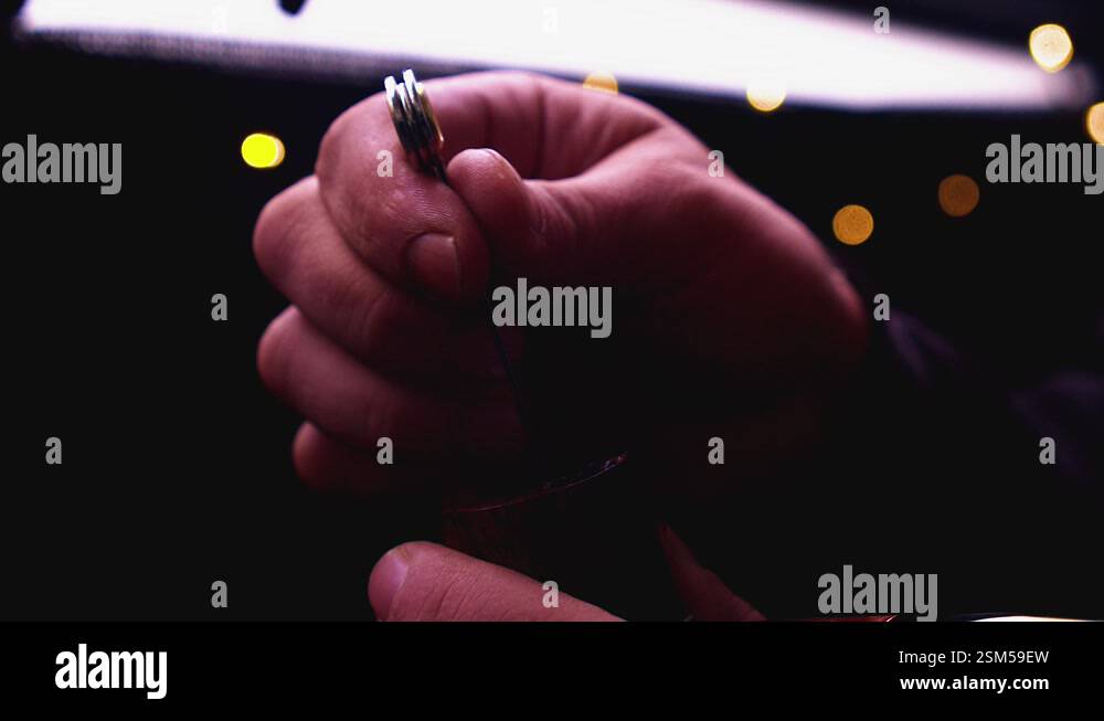 Backlit closeup: Man uses tamper to tamp tobacco in smoking pipe Stock ...