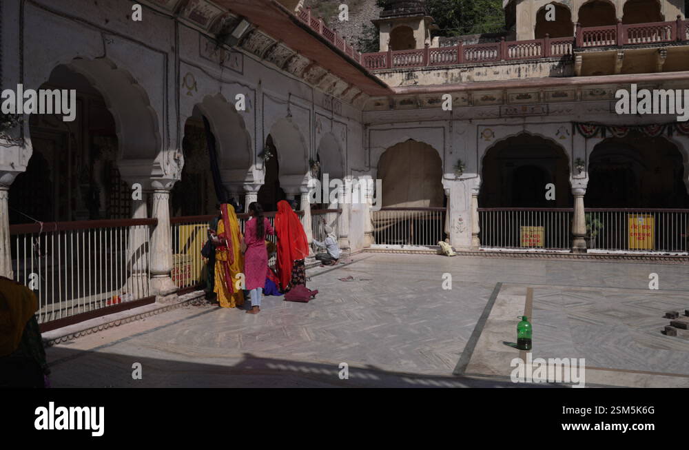 Indian pilgrims making offerings in Galtaji temple, Rajasthan, Jaipur ...