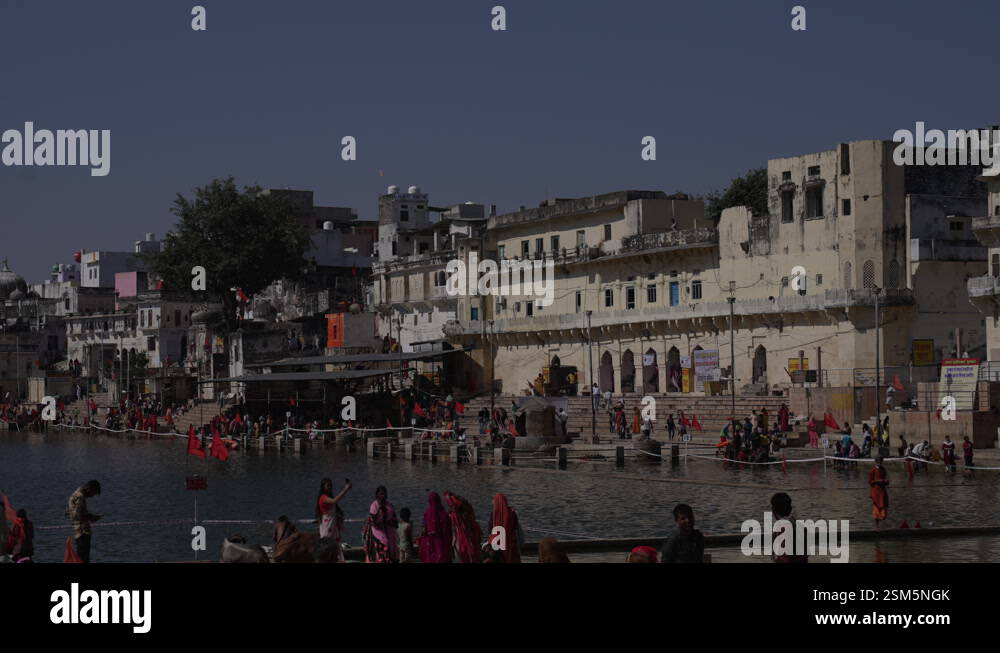 Indian pilgrims in Barhama lake and bathing ghats, Rajasthan, Pushkar ...