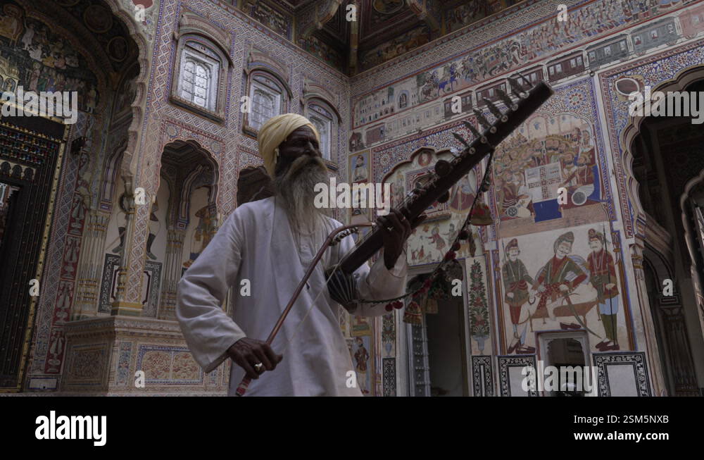 Musician playing sitar inside a haveli courtyard, Rajasthan, Nawalgarh ...