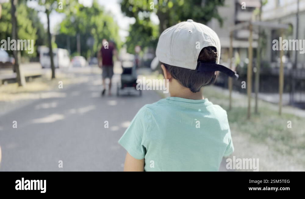 Daytime Sidewalk Walk - Boy Slows Pace Down, Behind Mom, Quietly ...
