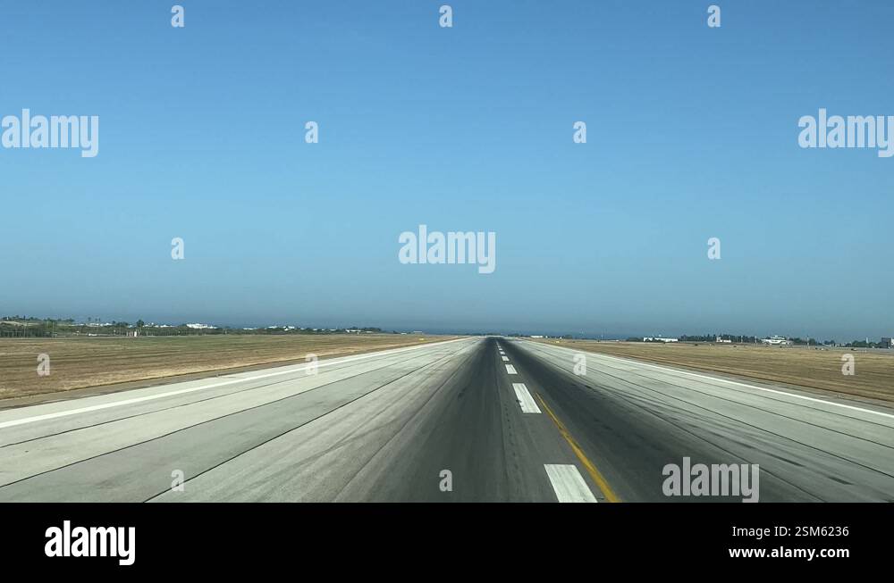 Real time take off as seen by the pilots in a sunny summer day with the ...