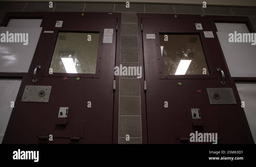 Prison cell doors inside of prison or jail facility locked and closed ...