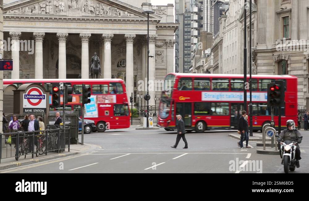 london buses pass in front of mansion house and bank underground st ...