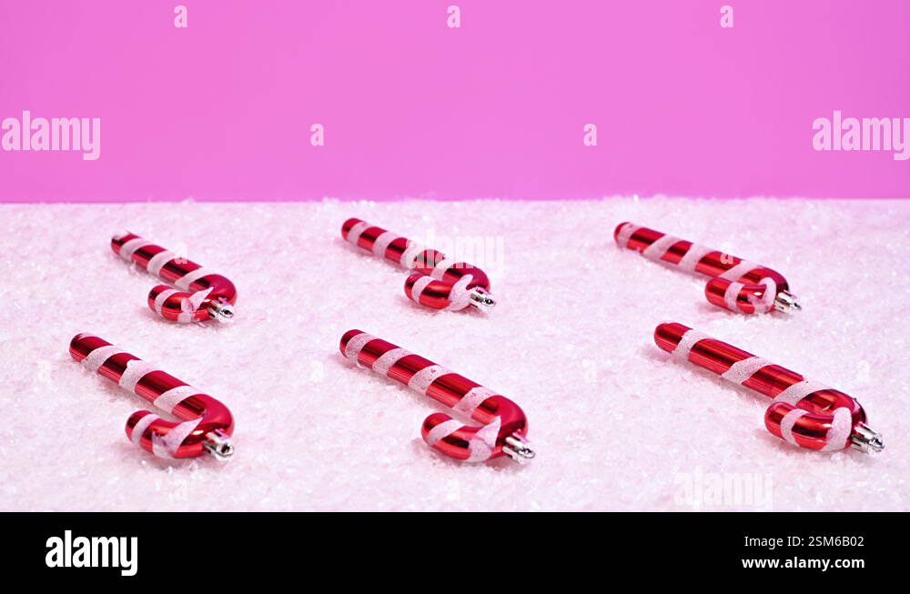 Candy Canes Twirl and Dance on a Snowy Background in Stop Motion Stock ...