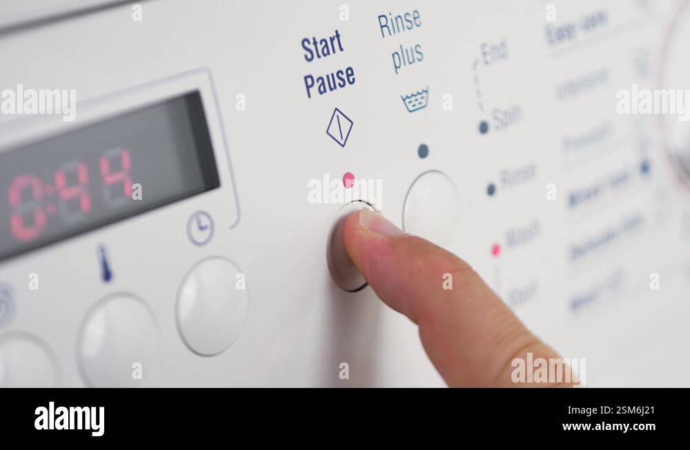 Close up shot of slow motion finger pressing start pause button on ...
