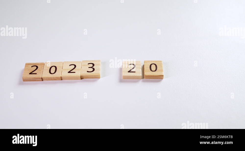 Wooden Tiles of the year 2023 put together on the table as a righthand ...