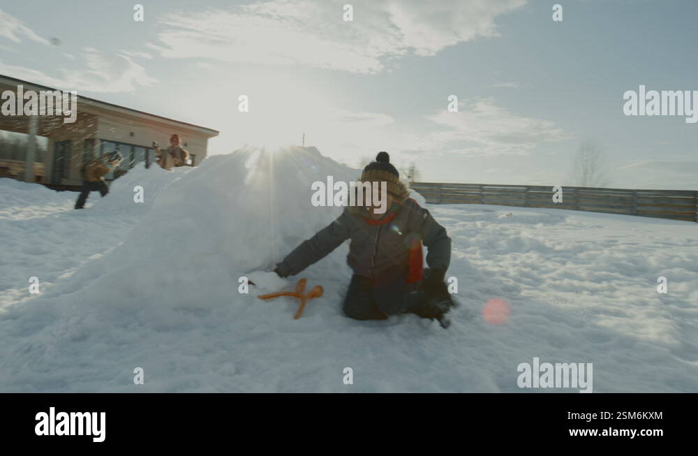 African American Boy Playing Snowball War with Friends Outdoors Stock ...