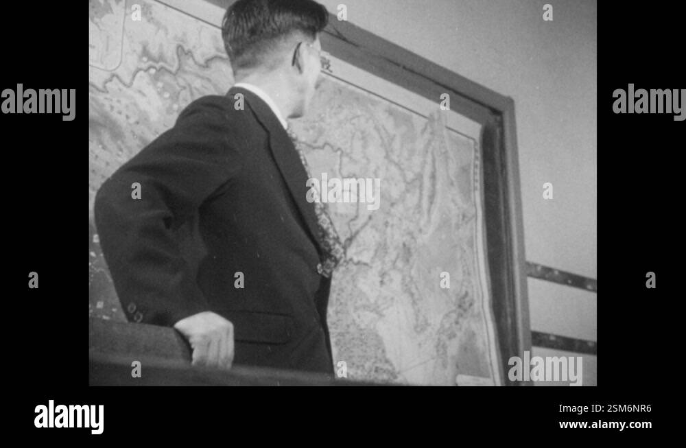 1950s: Students bowing to the teacher, sit at their desk. Teacher ...