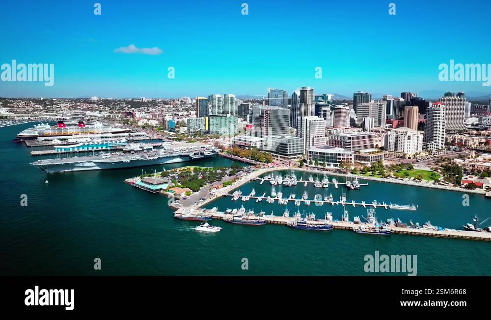 Seaport village in San Diego with a view of the USS Midway and lots of ...