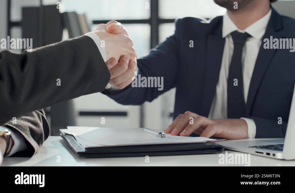 Businessmen Signing Document and Closing Deal with Business Partner ...