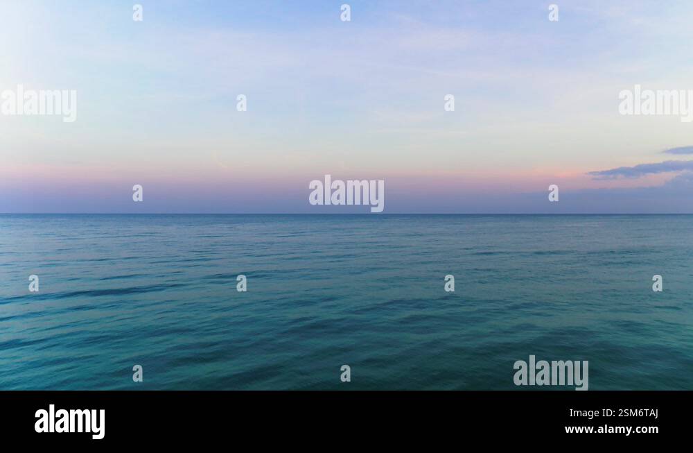 Amazing panoramic sunrise or sunset sky with delicate colorful clouds ...