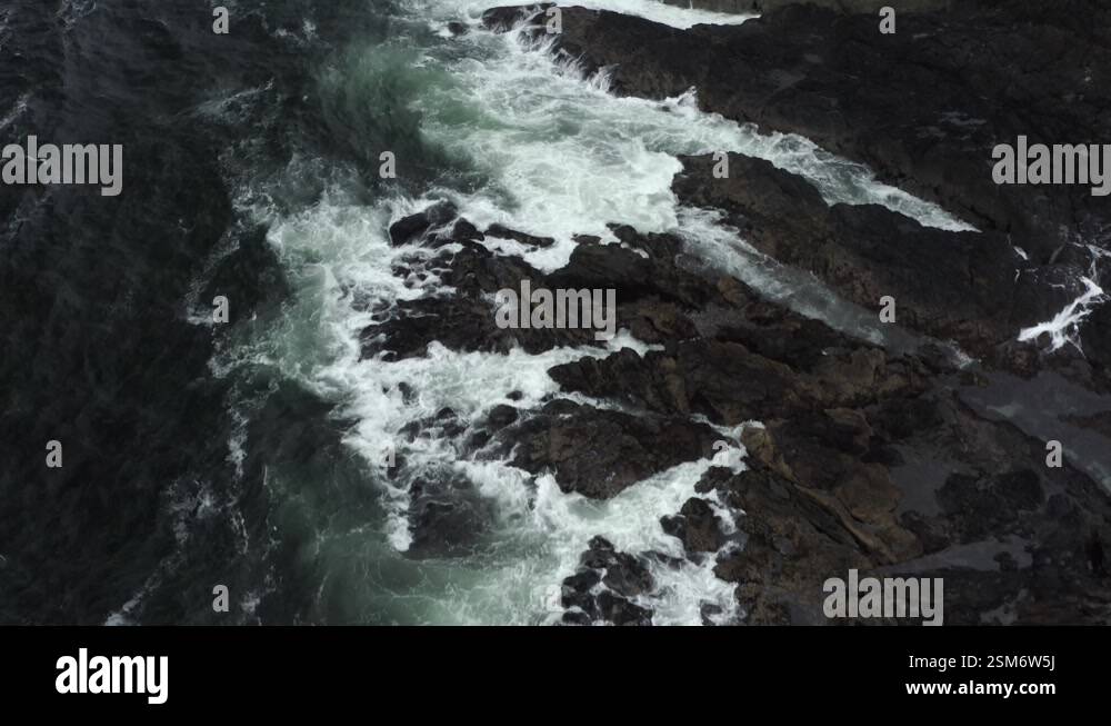 Flying Over Foamy Waves Crashing Over Rocks Of Frank Island, Tofino BC ...