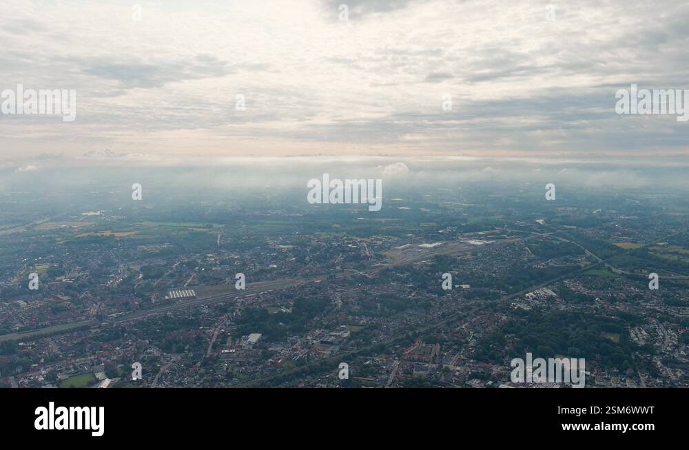 Ghent, Belgium. Sun rays and beautiful clouds. On the ground, a suburb of the Stock Video ...