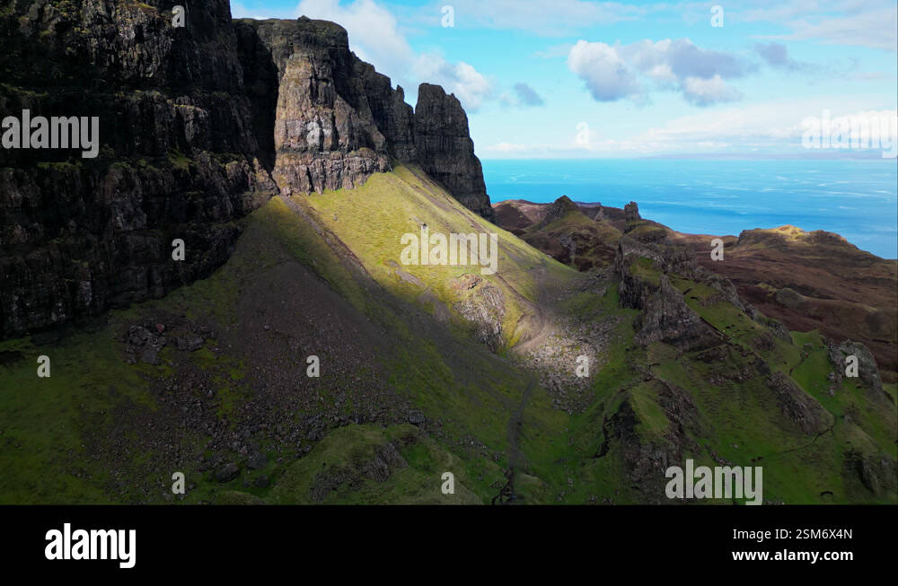 Light bursts between cliffs in the Scottish highlands illuminating ...