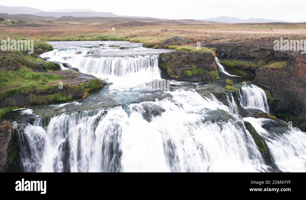 Aerial: Reveal Reykjafoss waterfall presents itself as a powerful ...
