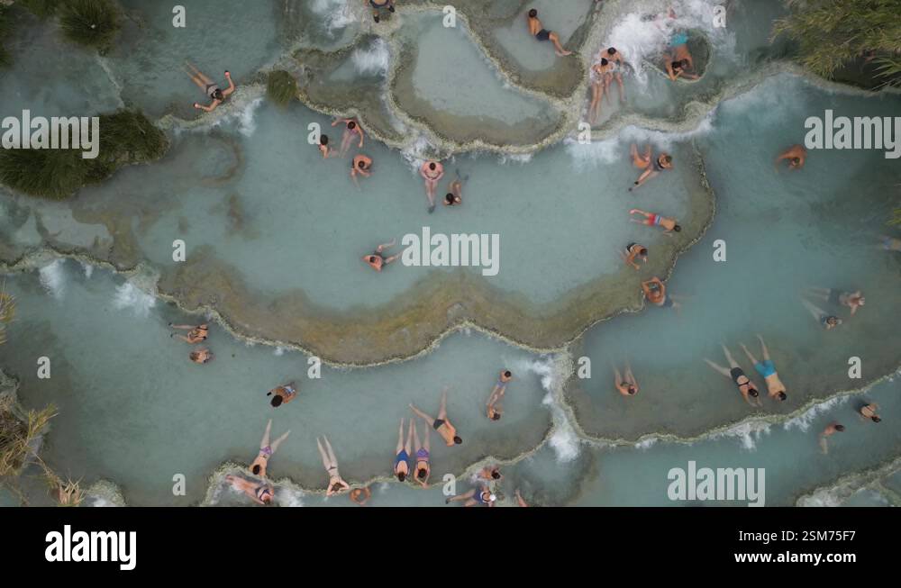 Top Down Boom Shot Reveals People Bathing. Thermal Hot Springs ...
