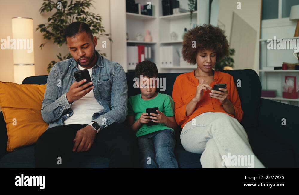 African American family busy on their phones, ignoring real life ...
