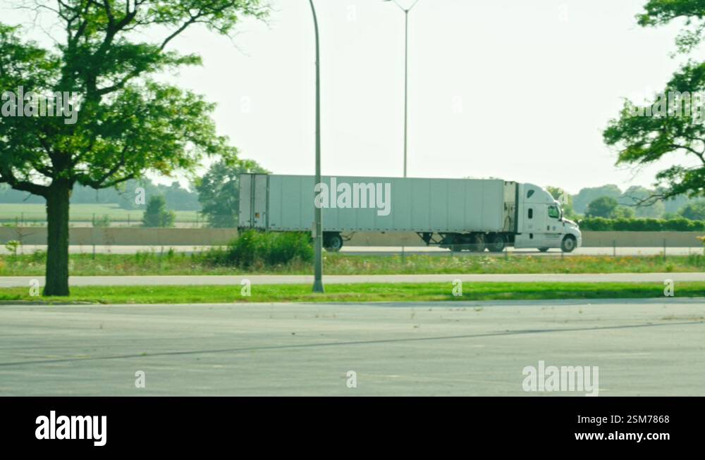 epic slow motion of a dry van semi tractor and trailer driving on Stock ...