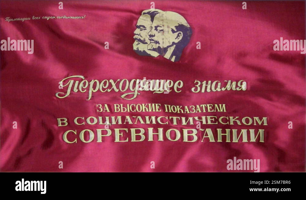 Soviet propaganda flag flies in slow motion. Slogans read ...