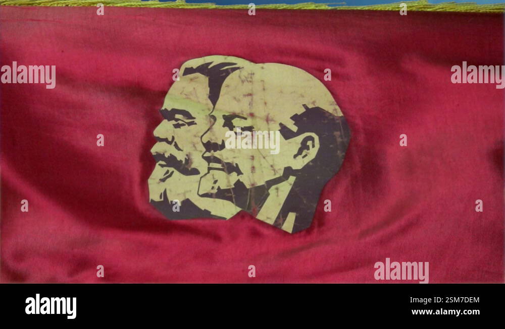 Slow motion close up of a portrait of Marx and Lenin on a Soviet flag ...