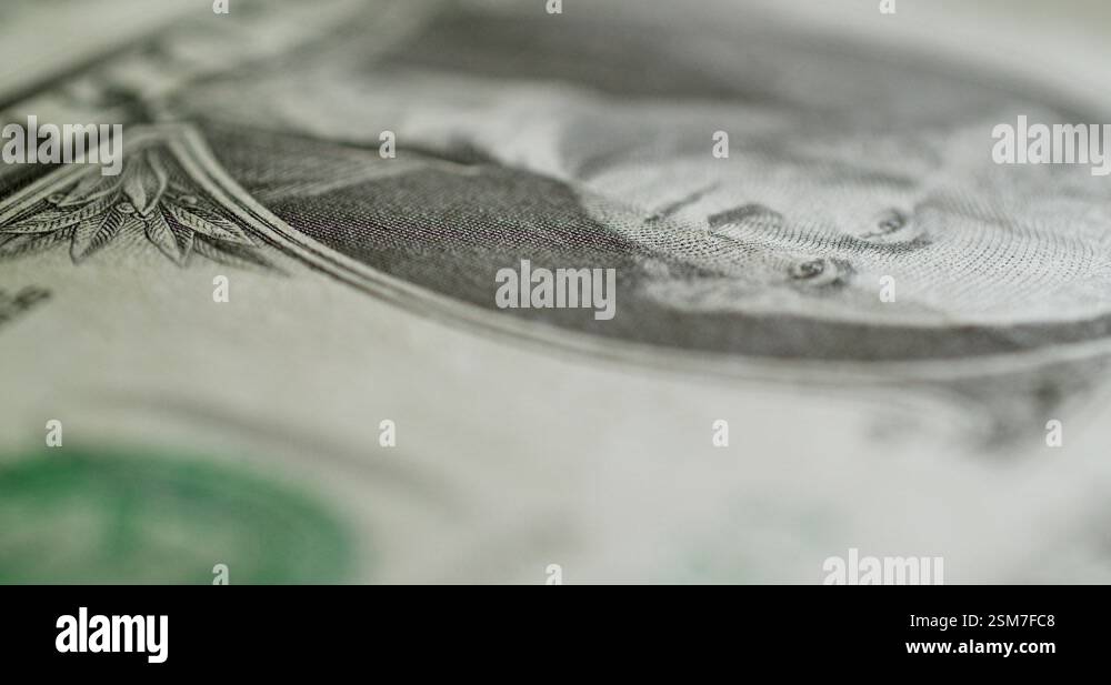 In a circular motion, a close-up of a one dollar bill bank note of the ...