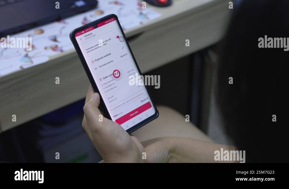 A lady ordering food using FOODPANDA apps. An Application foodpanda ...