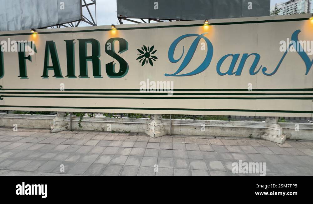 Panning shot view of the new Jodd Fairs Danneramit night market signage ...