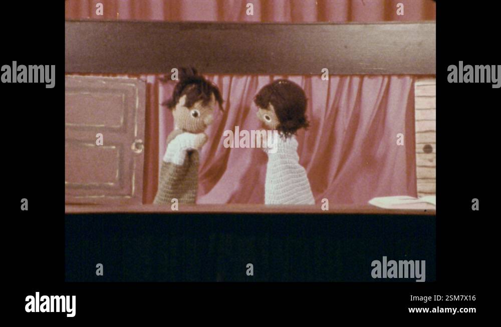 1970s: Two puppets talk to each other. Puppets crawl on floor towards ...