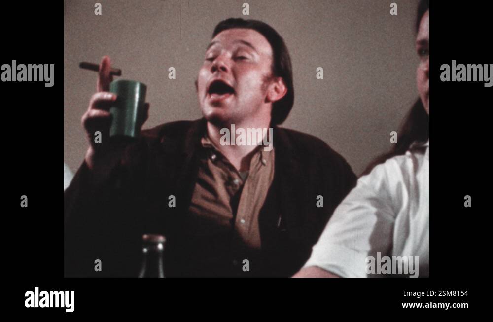 1970s: Woman in meeting talks. Man talks. People argue. Man in shirt ...
