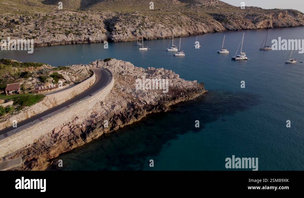 4k drone. Cala Sant Vicenç is a small resort town in north-eastern ...
