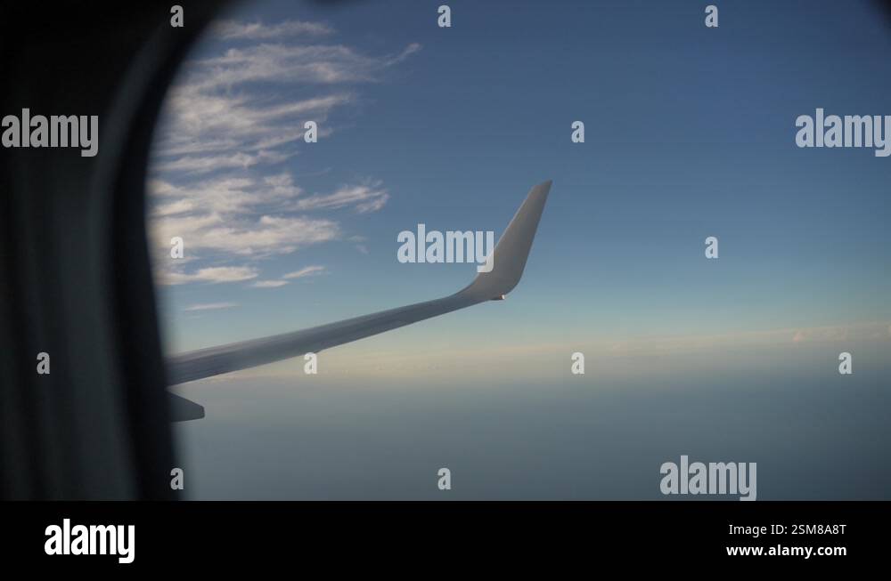 Sky view out plan window golden hour Stock Video Footage - Alamy