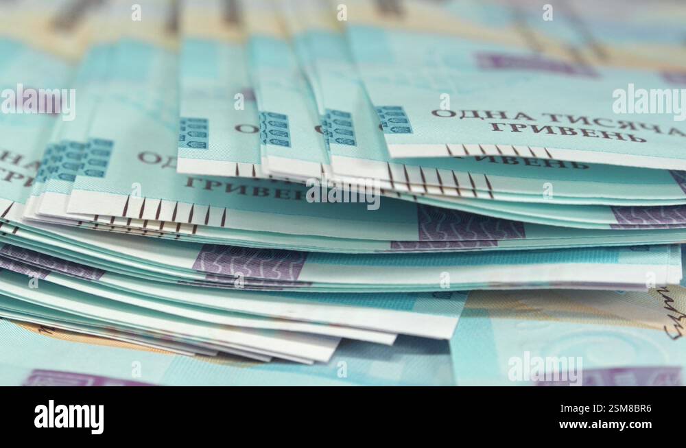 Real Ukrainian paper money of blue yellow color. Banknotes 1000 Hryvnia ...