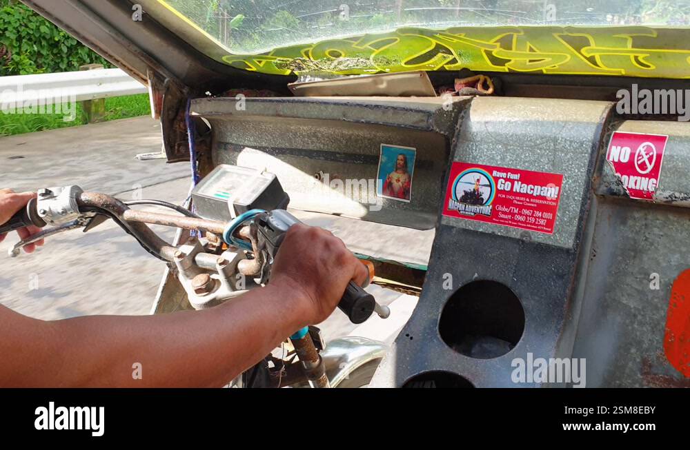 Close up of driving Filipino tricycle taxi motorbike in Palawan Stock ...